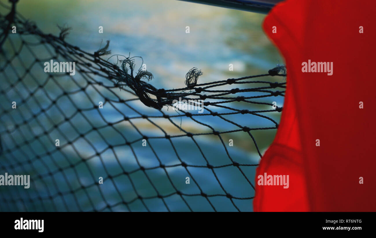 Life jacket and net on boat. Safety net on boat. Ropes on boat. Safety ...