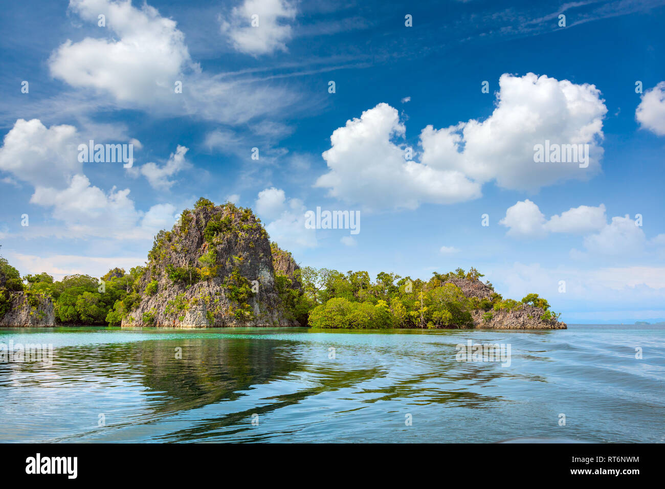 Waterfront view of alone island coastline, tropical small island in ...