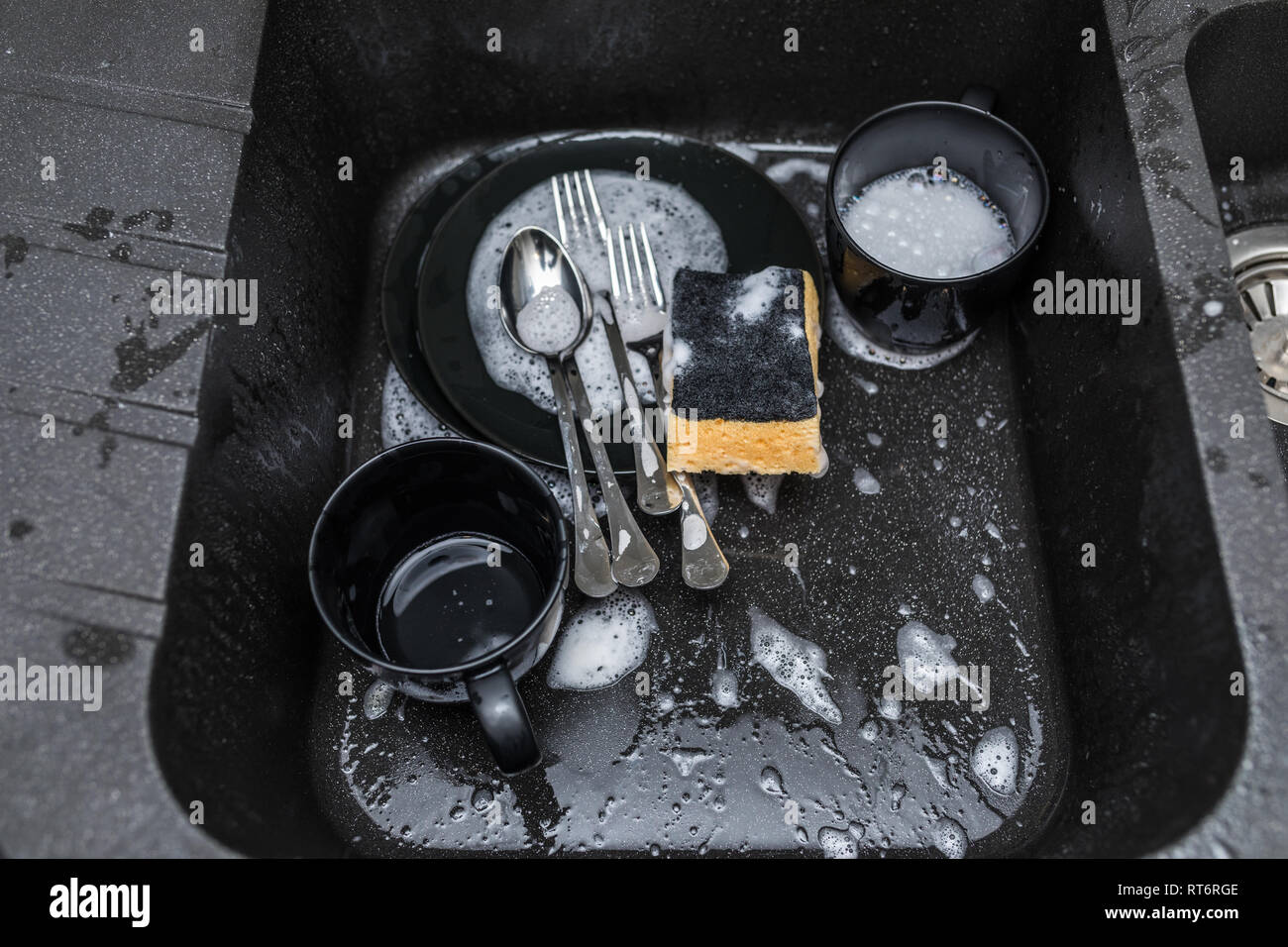 dirty dishes in a kitchen sink at home Stock Photo - Alamy