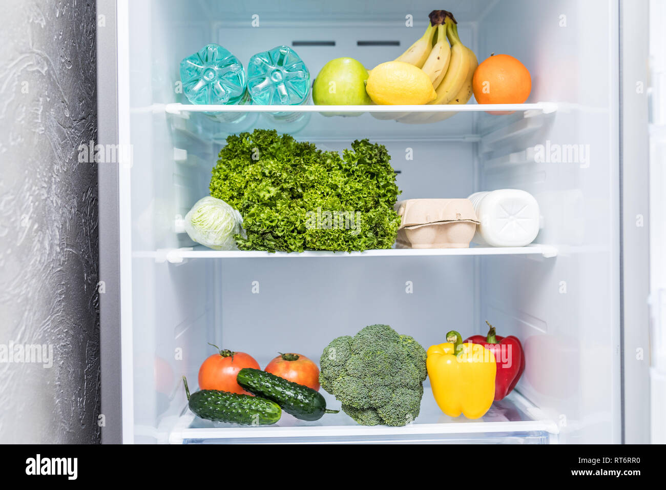 Open fridge full of fresh fruits and vegetables, healthy food ...
