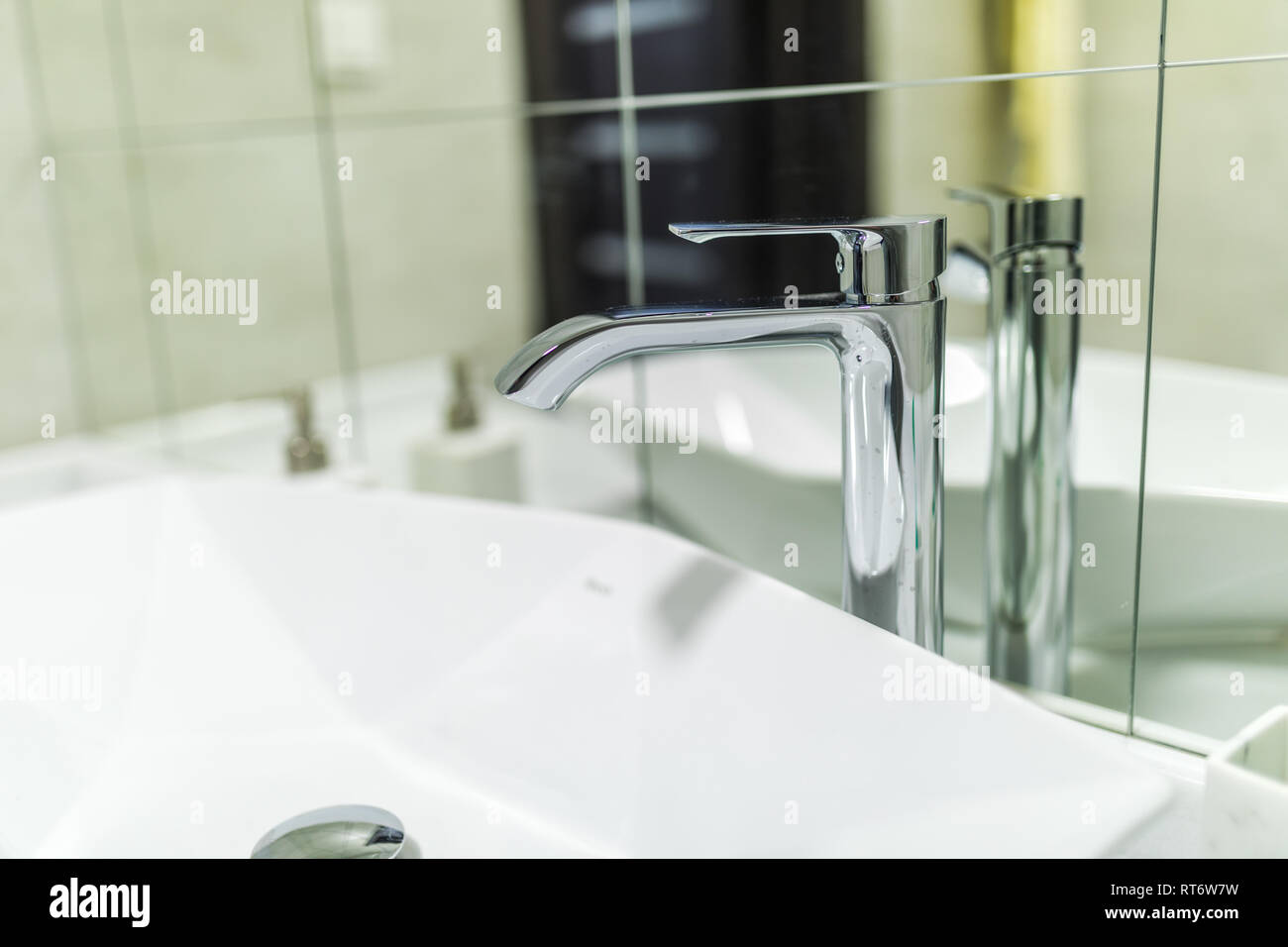 Interior of bathroom with sink faucet and mirror. Modern design of ...