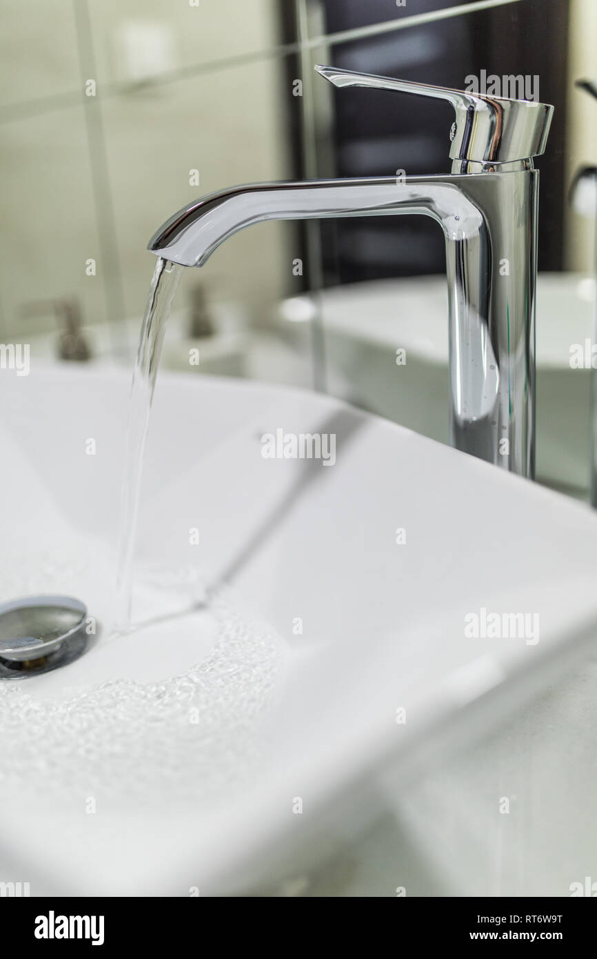 Interior of bathroom with sink faucet and mirror. Modern design of ...