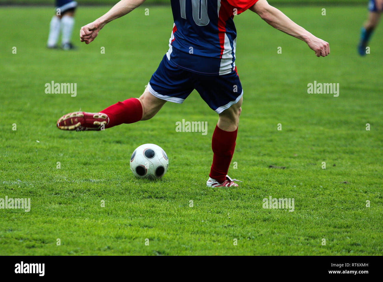 A detail of footballer´s legs during the footbal kick Stock Photo - Alamy