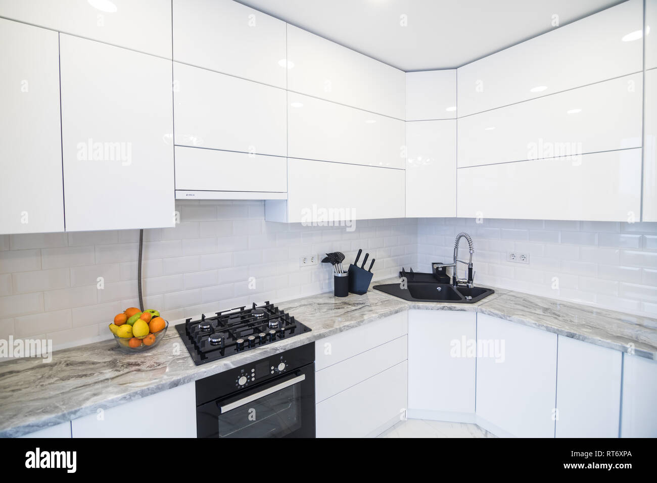 Modern minimalistic kitchen with gas cooktop and accesories Stock Photo ...