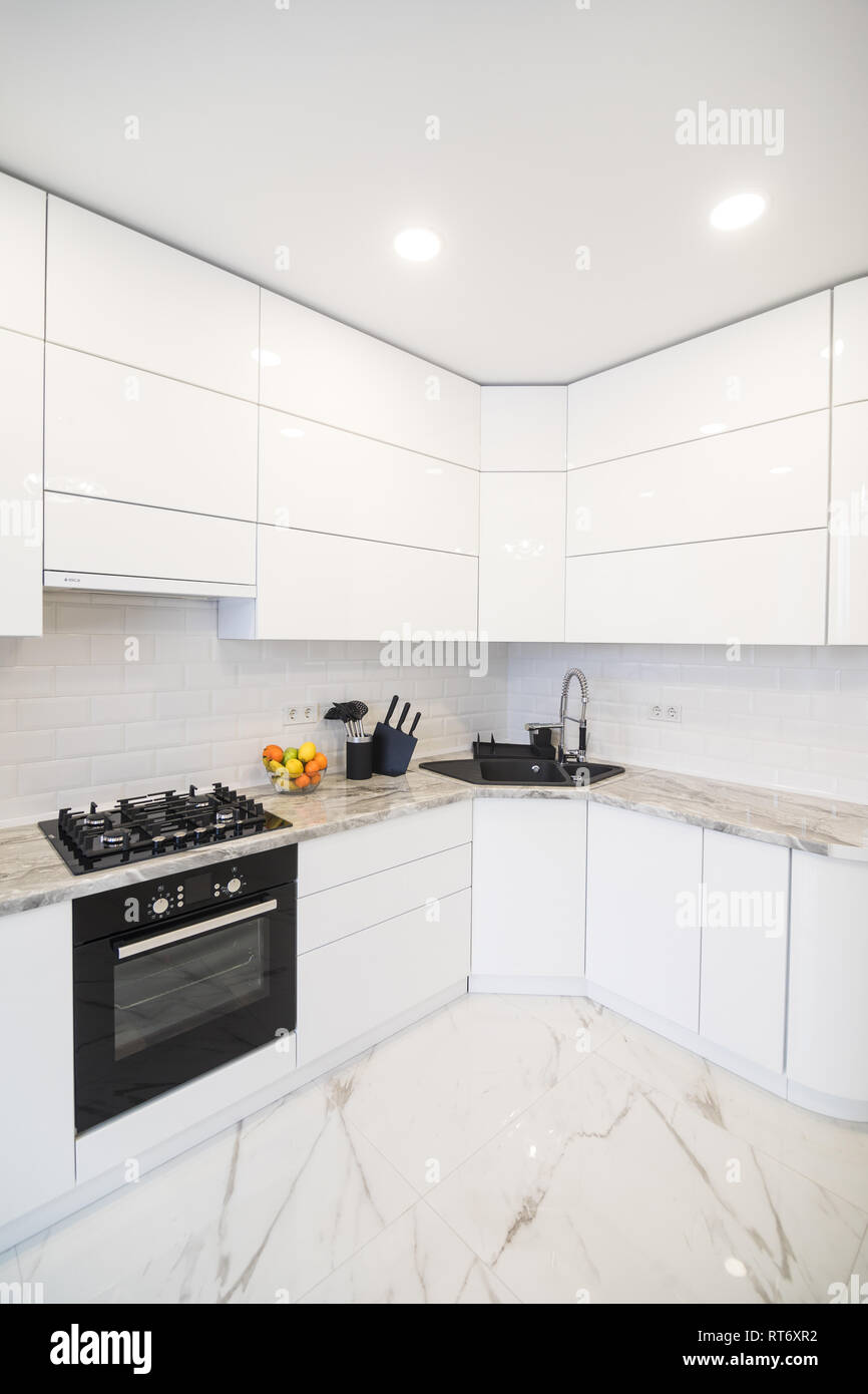 Modern minimalistic kitchen with gas cooktop and accesories Stock Photo ...