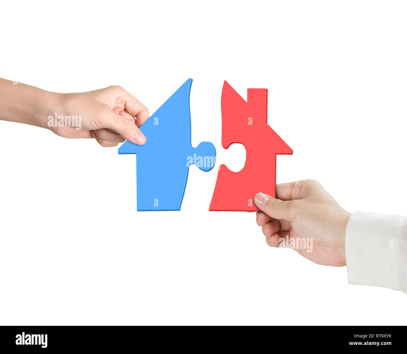 Woman and man two hands assembling house shape puzzles of different ...