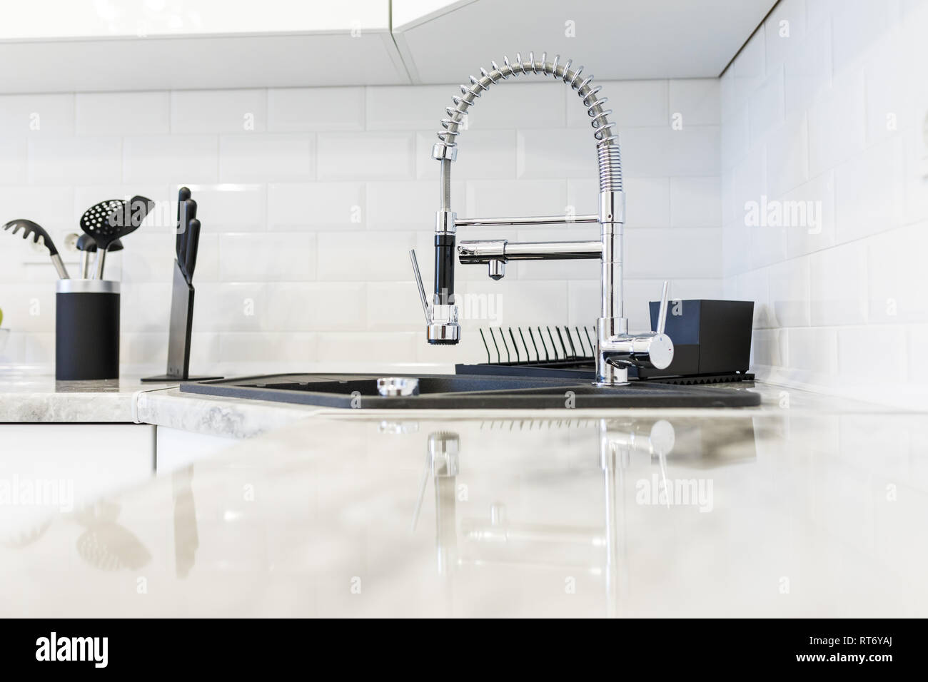 Shiny stainless steel faucet with chrome water tap Stock Photo - Alamy