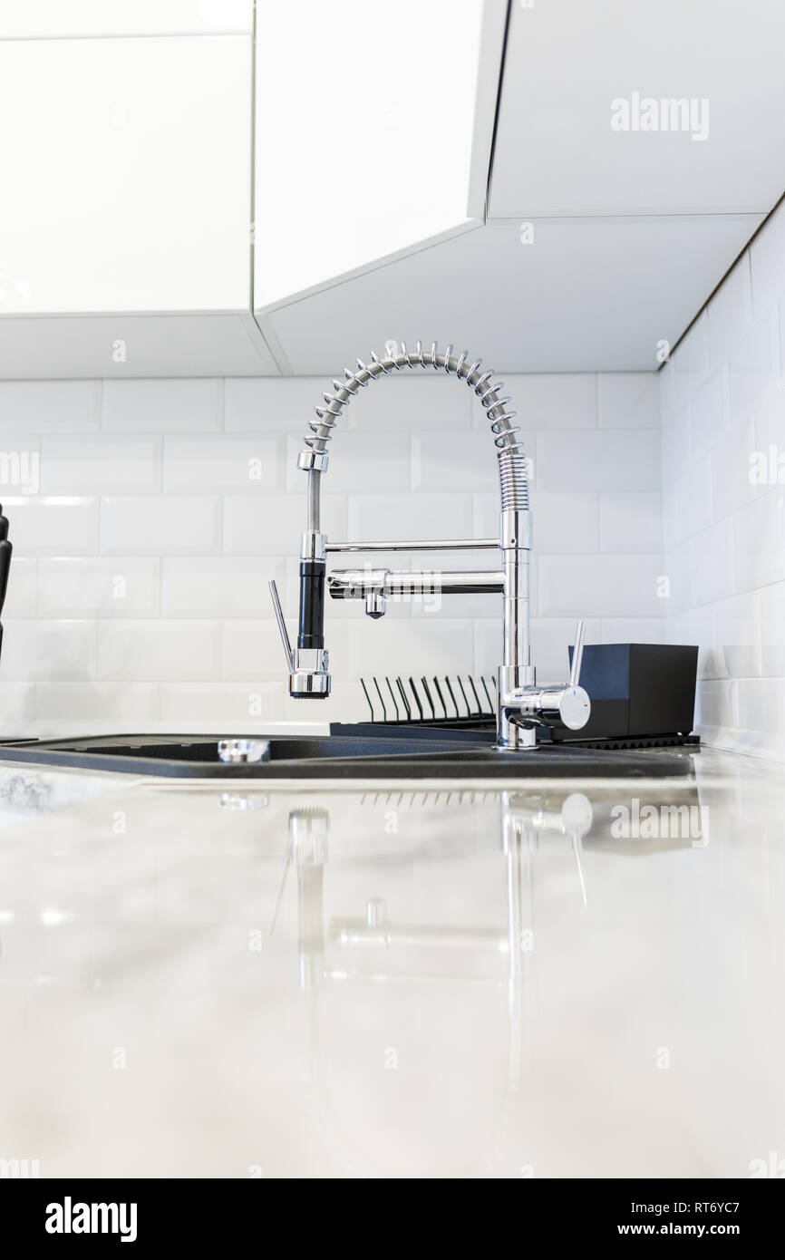Shiny stainless steel faucet with chrome water tap Stock Photo - Alamy