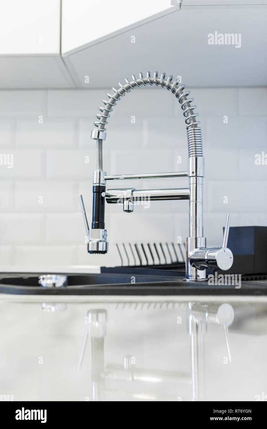 Photo of a nice, fancy sink in a mostly white kitchen Stock Photo - Alamy