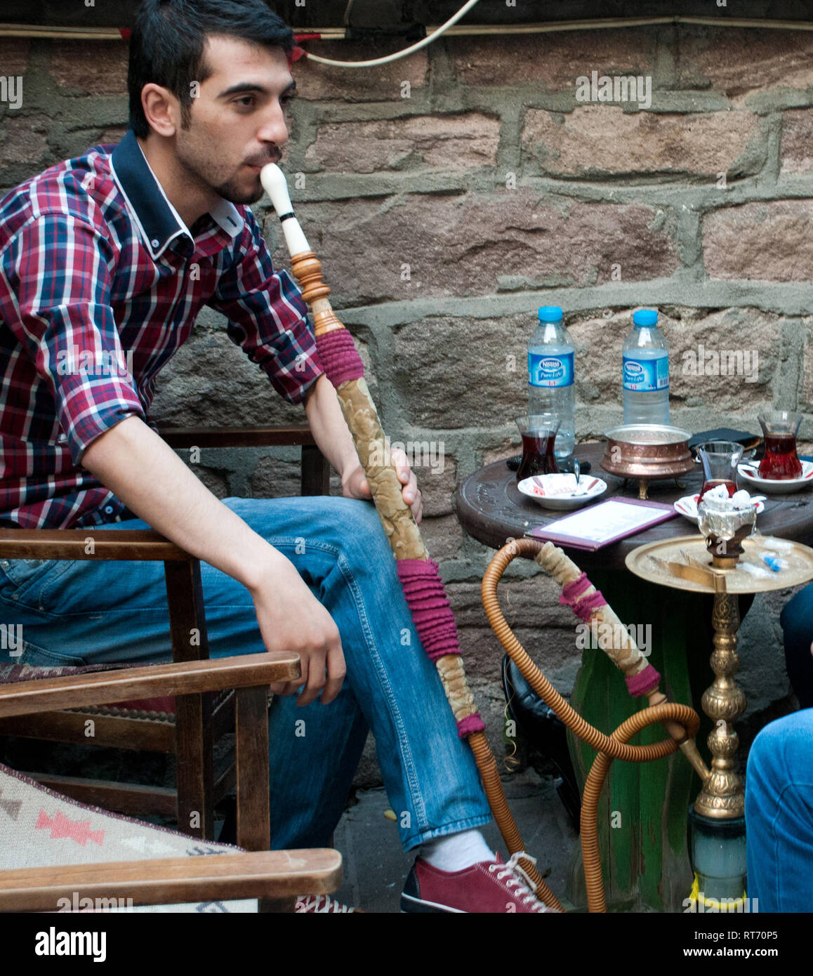 Asia, Turkey, Anatolia, Konya, man smoking hookah Stock Photo - Alamy
