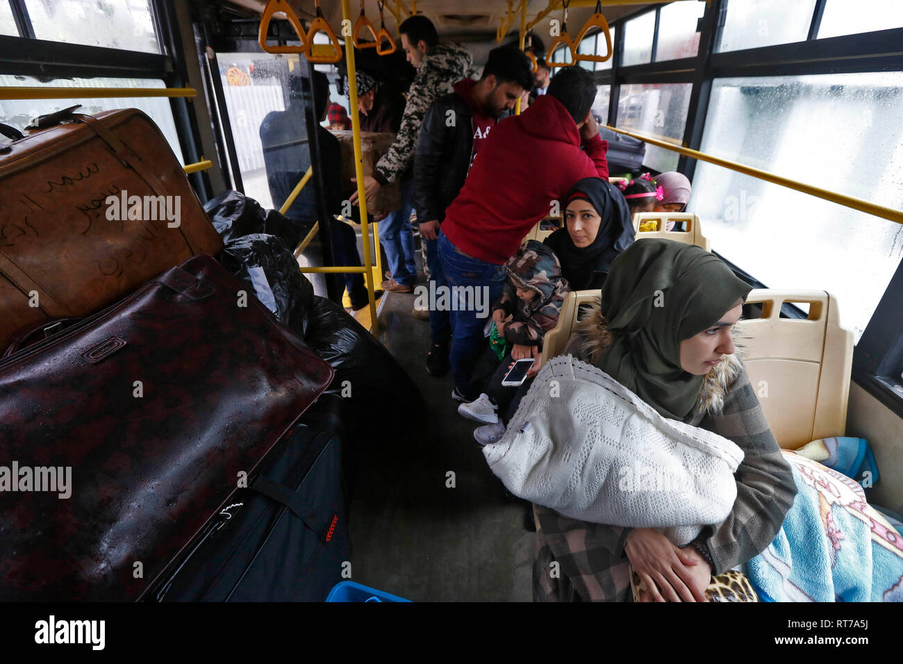 Beirut, Lebanon. 28th Feb, 2019. Syrian refugees take a coach bus ...