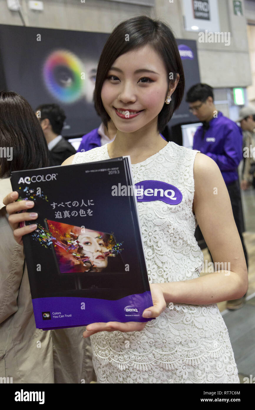 Yokohama, Japan. 28th Feb, 2019. A booth assistant poses for a ...