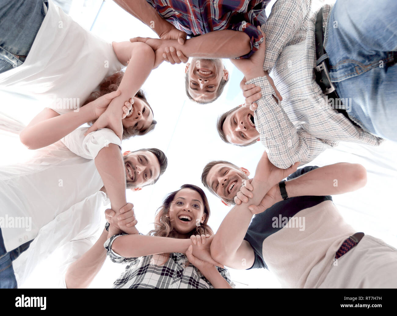 Happy group of businesspeople stacking their hands in cooperation Stock ...