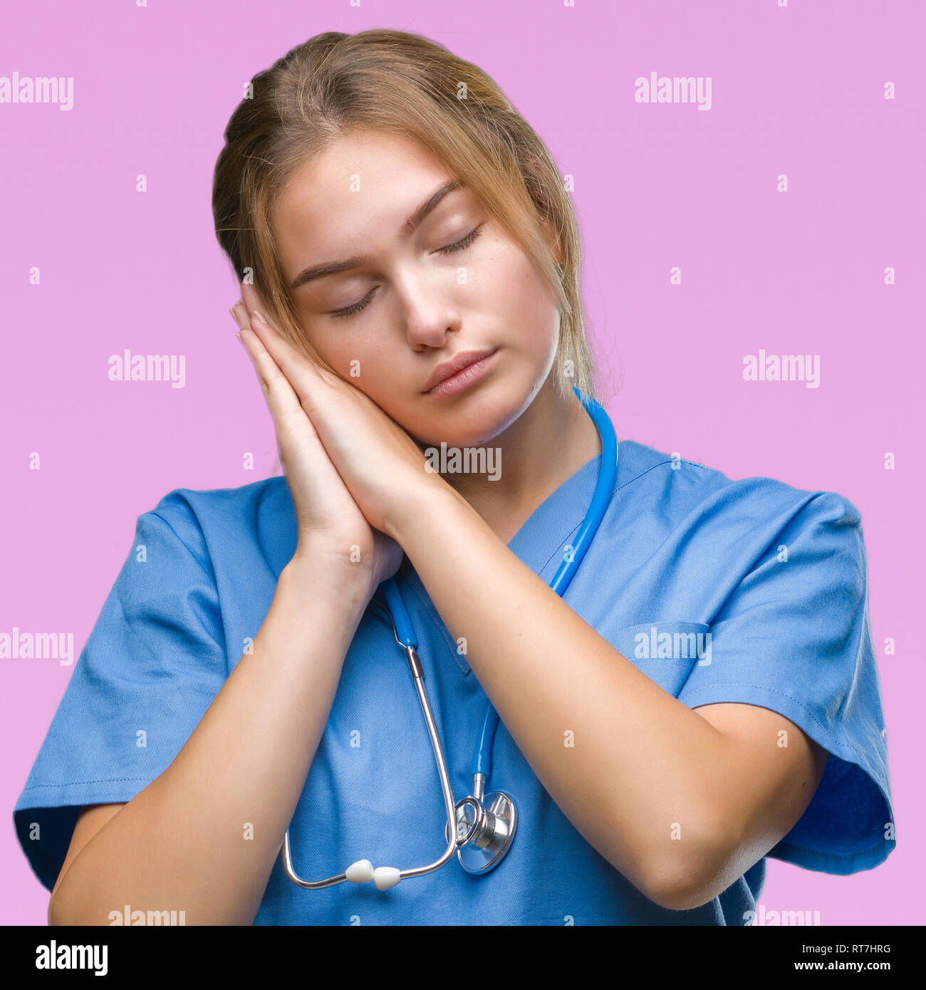 Young caucasian doctor woman wearing surgeon uniform over isolated ...