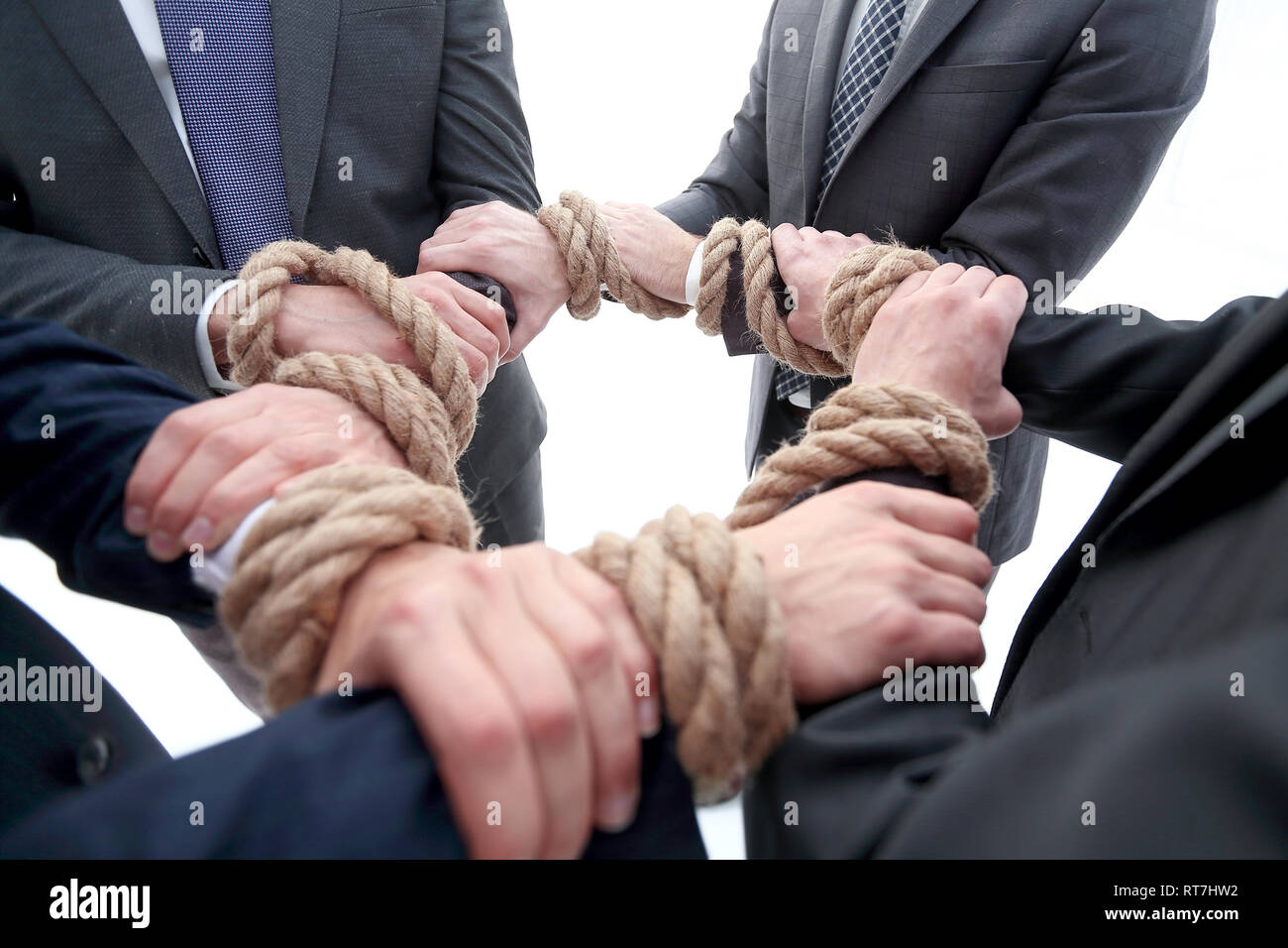 closeup.Hands holding rope forming a circle Stock Photo - Alamy