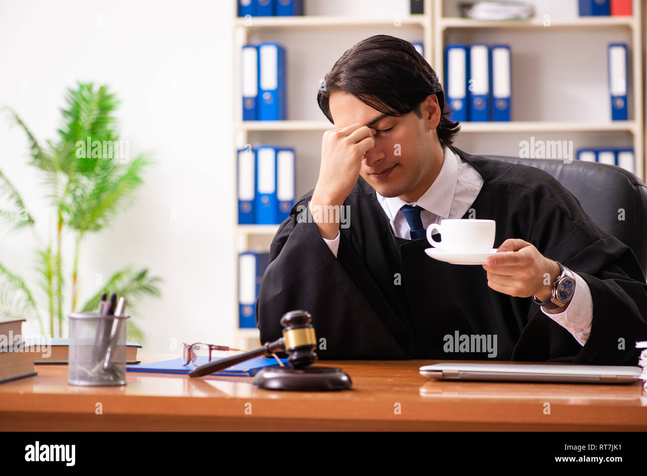 Young handsome judge working in court Stock Photo - Alamy