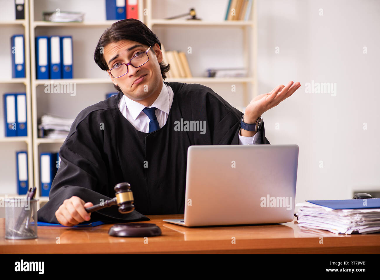 Young handsome judge working in court Stock Photo - Alamy