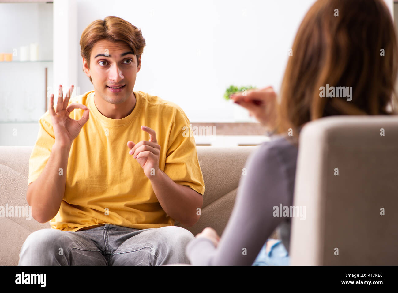 Woman and man learning sign language Stock Photo - Alamy
