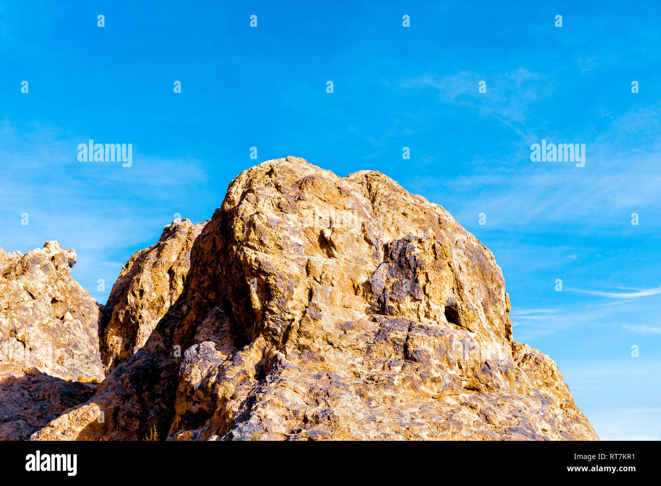 Rock peak closeup showing textures and details of peak under bright ...