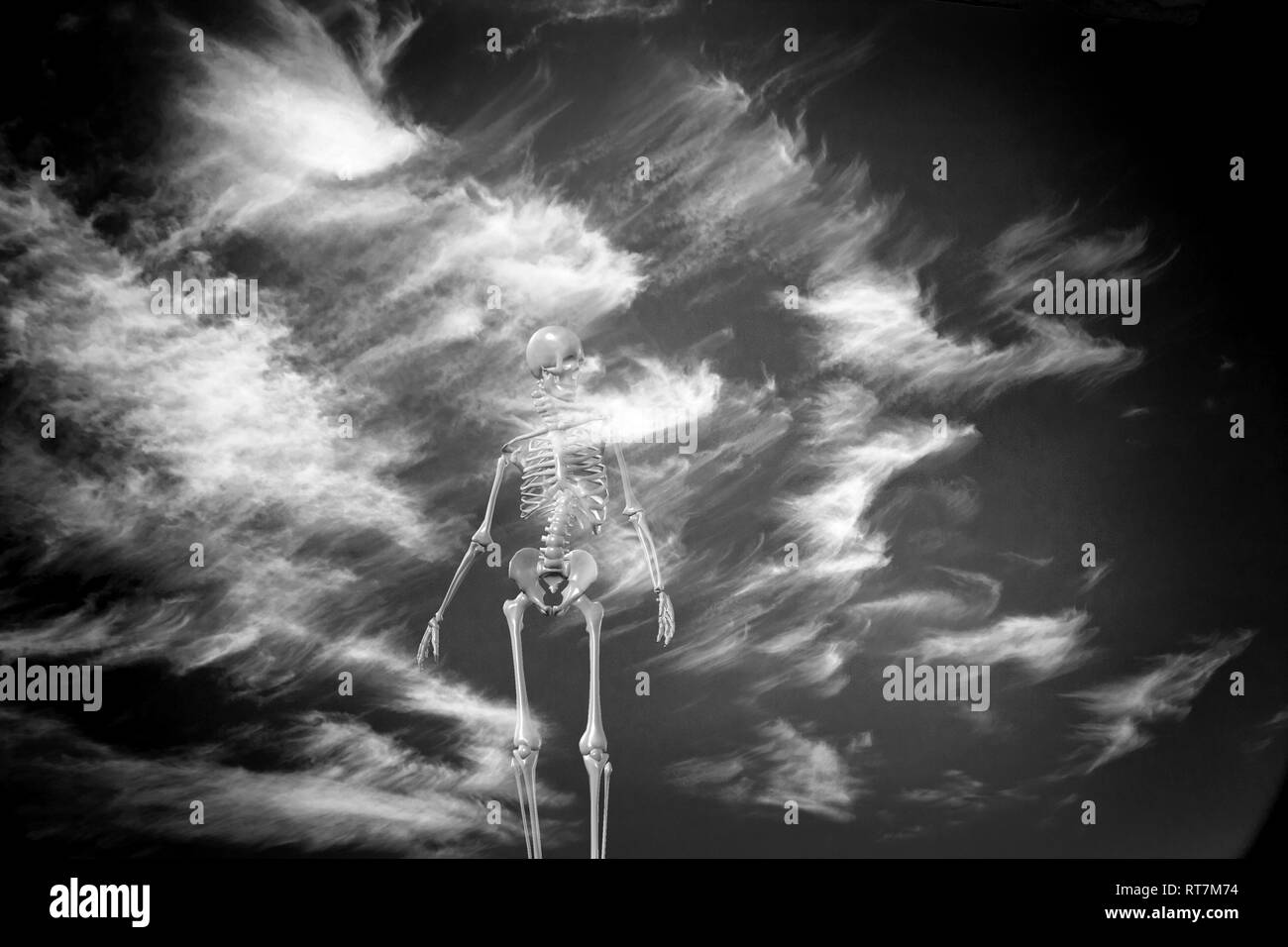 Surrealism. Skeleton with clouds on a background Stock Photo - Alamy