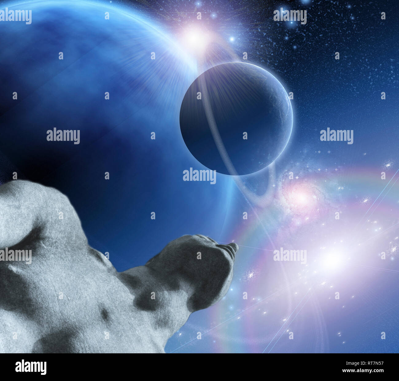Statue of man gazing upward to the sky of ringed planets Stock Photo ...