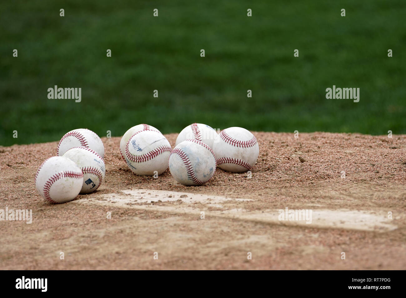 A pile of baseballs on the pitchers mound Stock Photo - Alamy