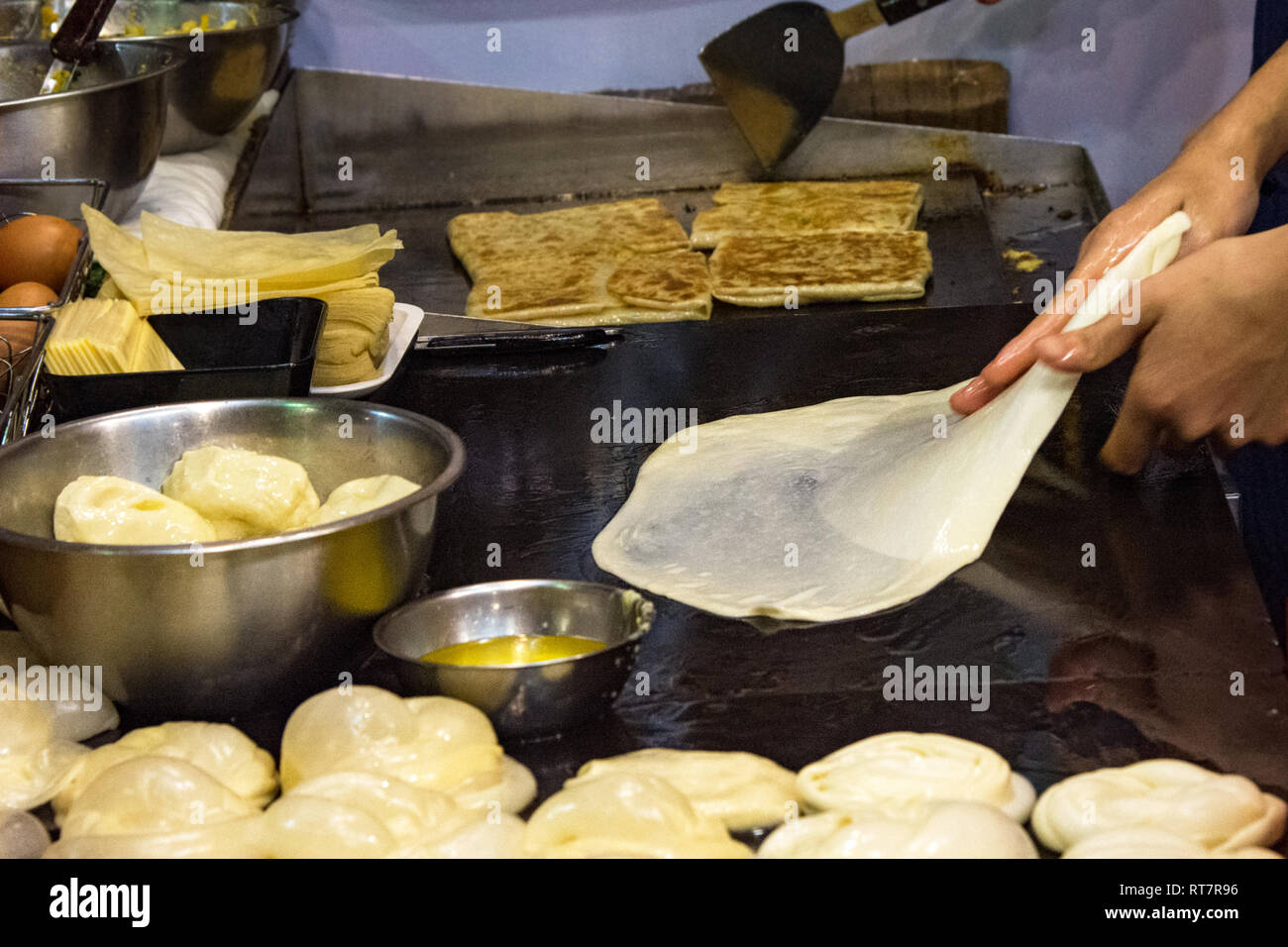 Making of Roti Canai, cooking process, Indian traditional street food ...
