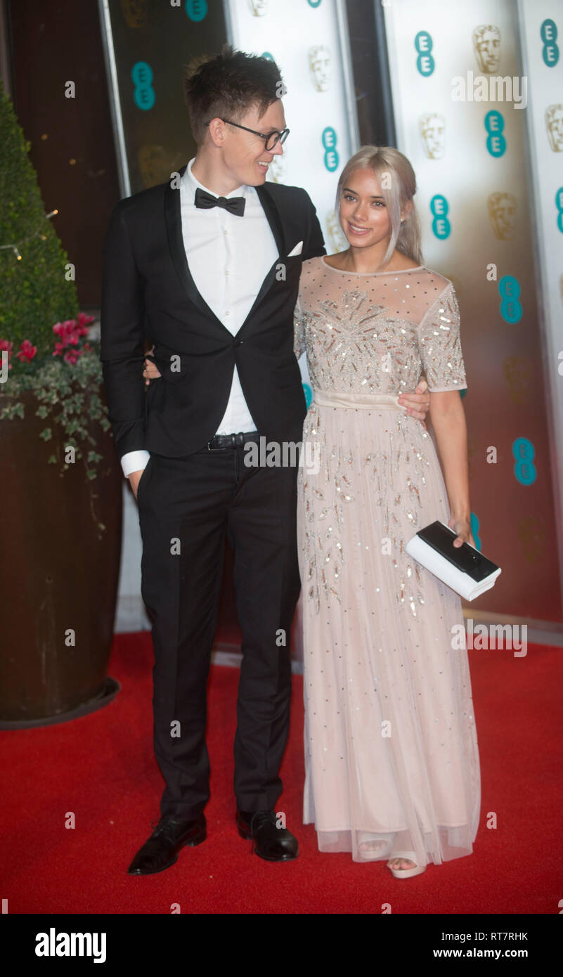 Caspar Lee and Ambar Driscoll at the 72nd British Academy Film Awards ...