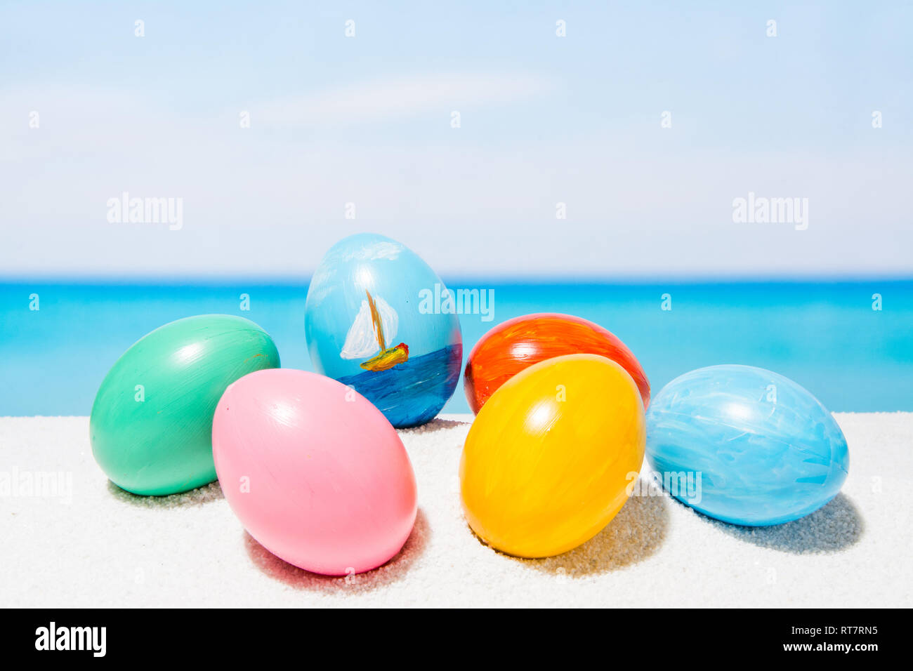 Easter on tropical beach background. Eggs on the white sand. Vacation ...