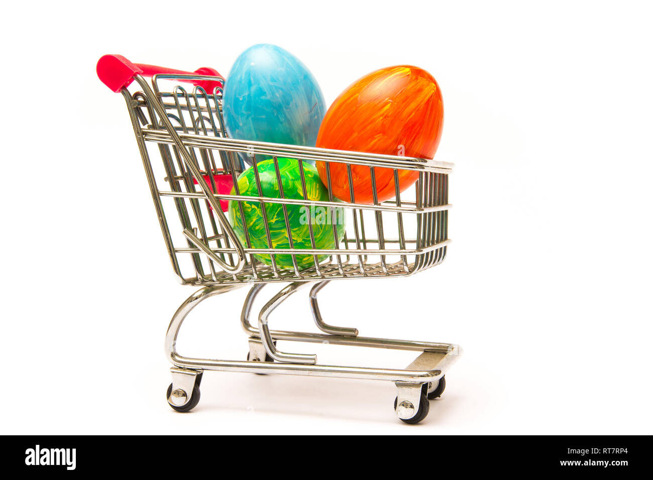 Easter shopping. Handmade colored eggs in cart. Business and selling in ...