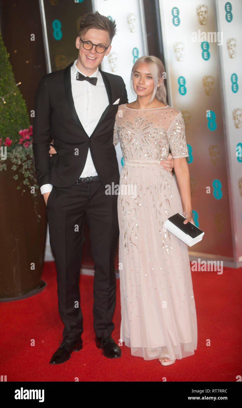 Caspar Lee and Ambar Driscoll at the 72nd British Academy Film Awards ...