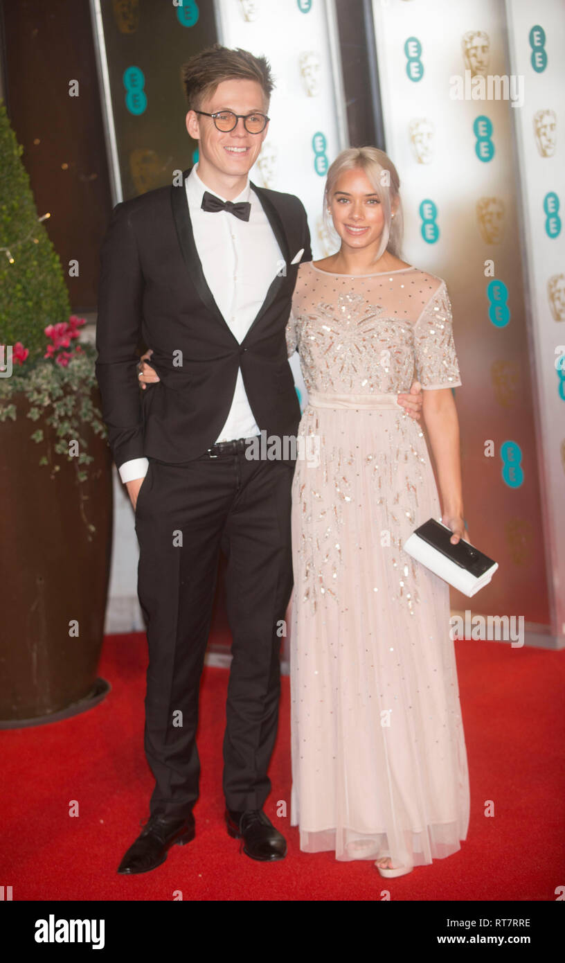 Caspar Lee and Ambar Driscoll at the 72nd British Academy Film Awards ...