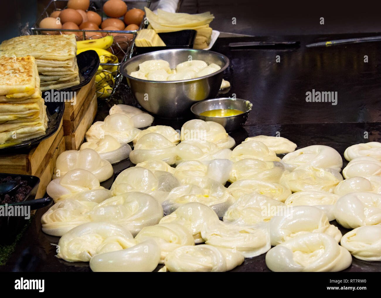 Making of Roti Canai, cooking process, Indian traditional street food ...
