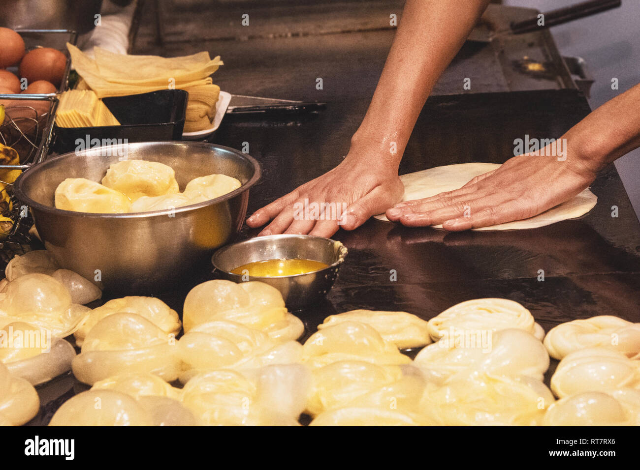 Making of Roti Canai, cooking process, Indian traditional street food ...