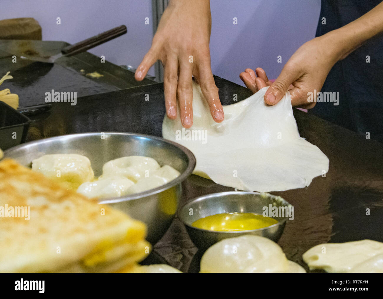 Making of Roti Canai, cooking process, Indian traditional street food ...