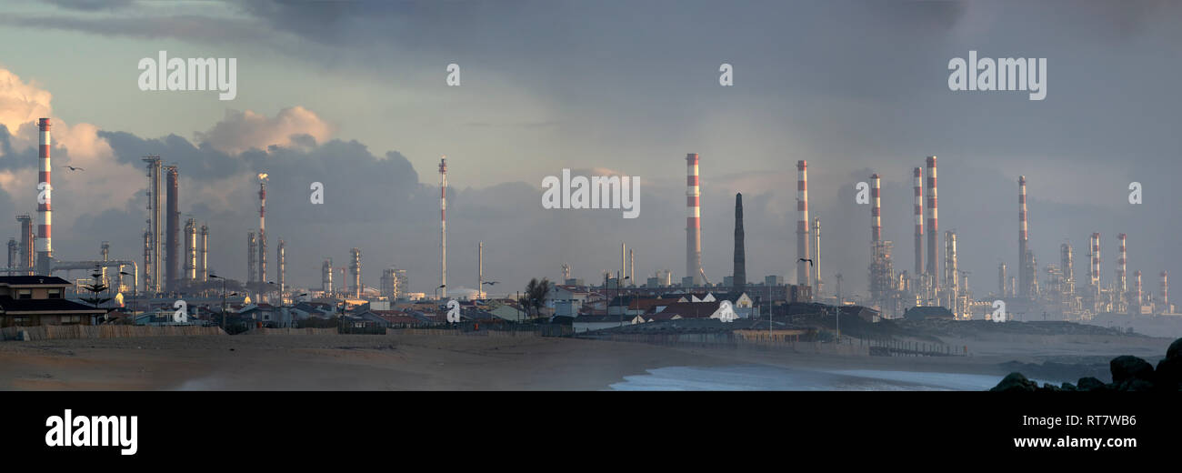 Panorama of part of a big oil refinery by the sea in the end of the day ...