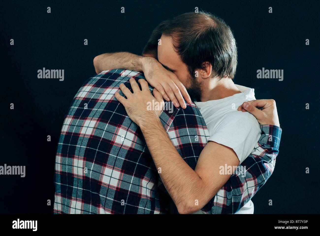 Guys hugging hi-res stock photography and images - Alamy