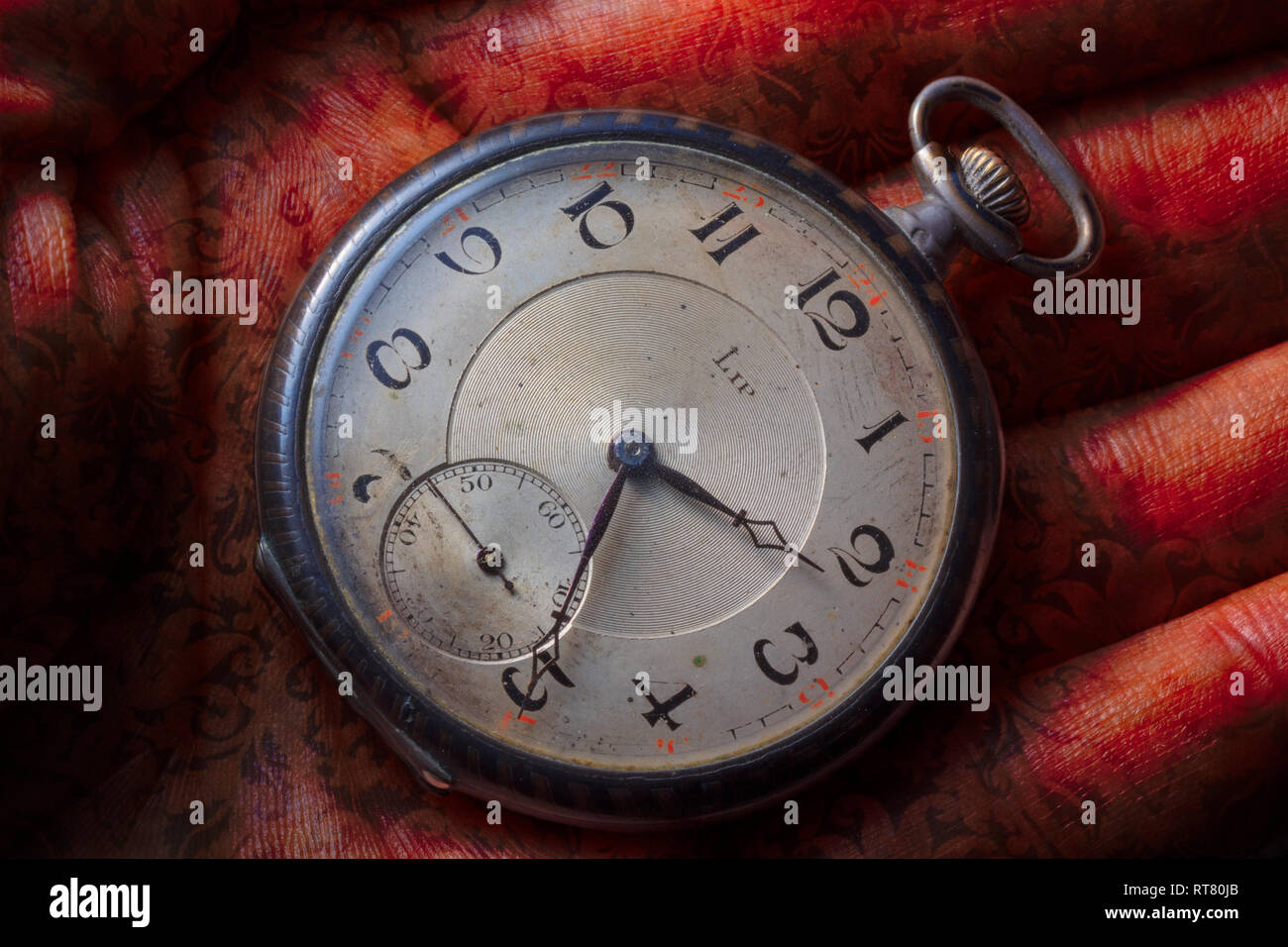 Lip pocket watch on a hand with henna-type ink look and pattern Stock ...