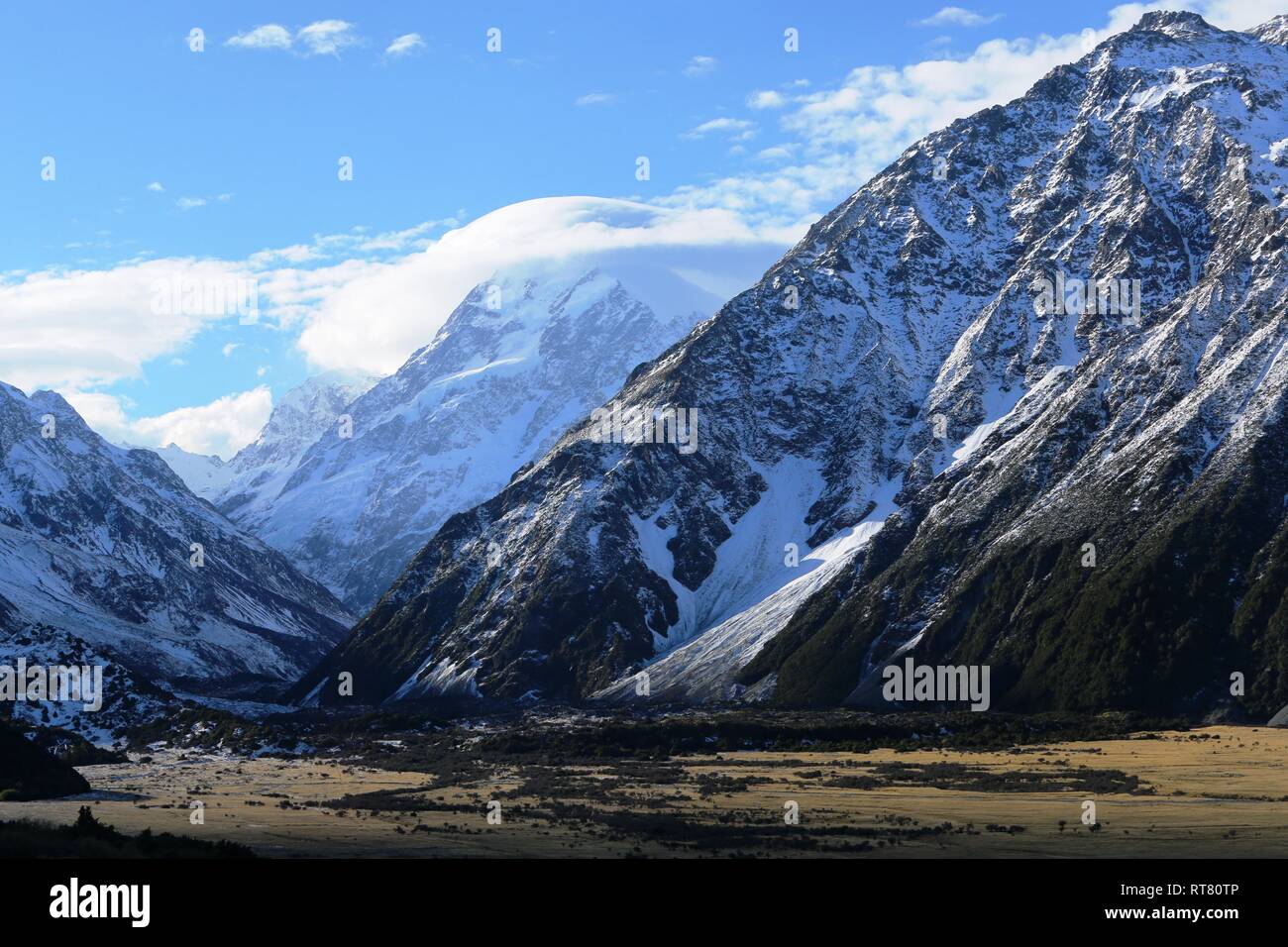 View to Mount Cook, New Zealand, its peak under cloud Stock Photo - Alamy