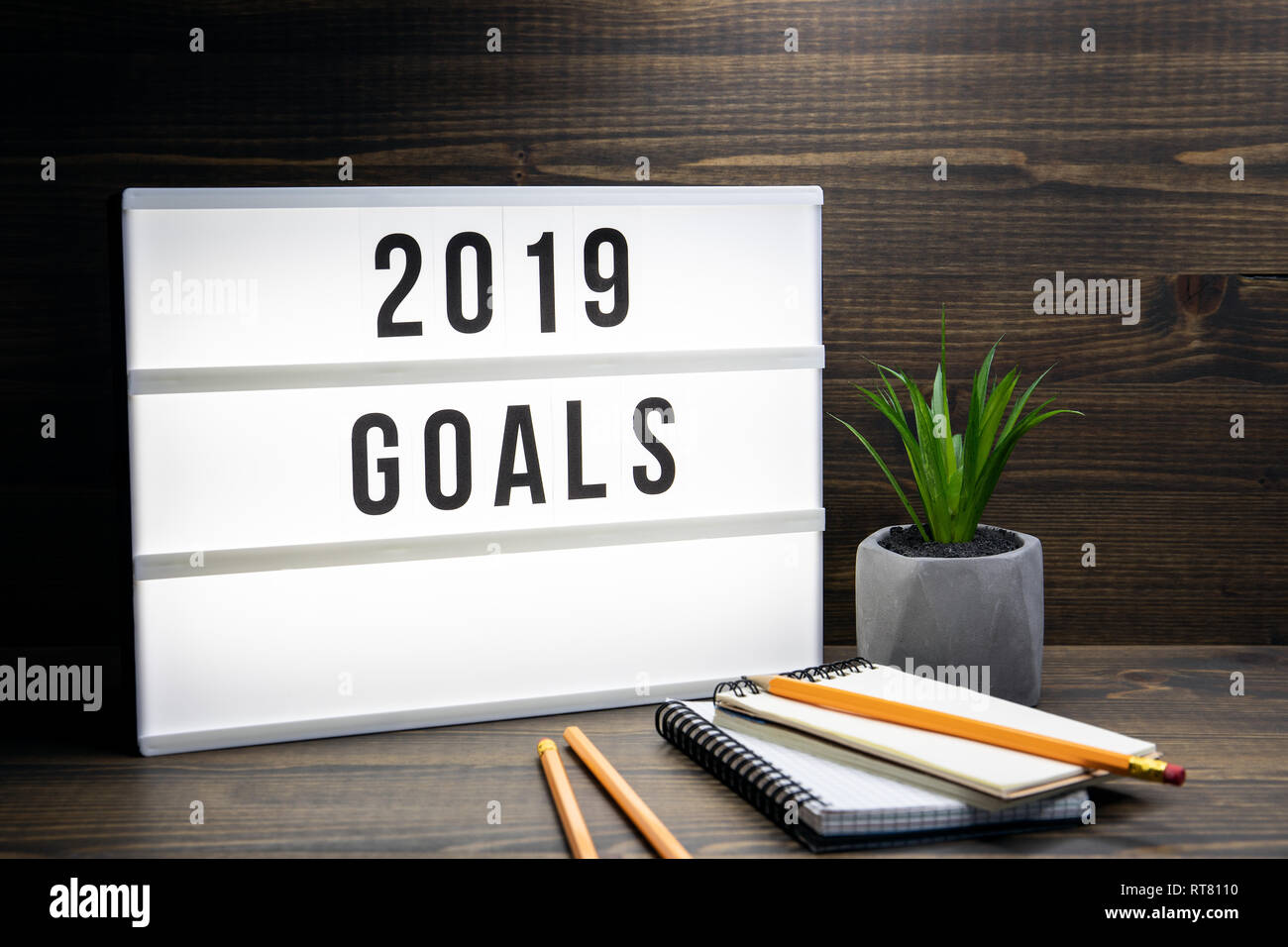 2019 goals concept. Text in lightbox. Wooden office table Stock Photo ...