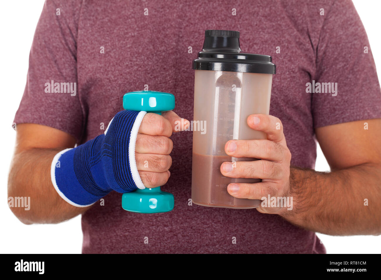 Close up picture of a young man holding a dumbbell and a shake Stock ...