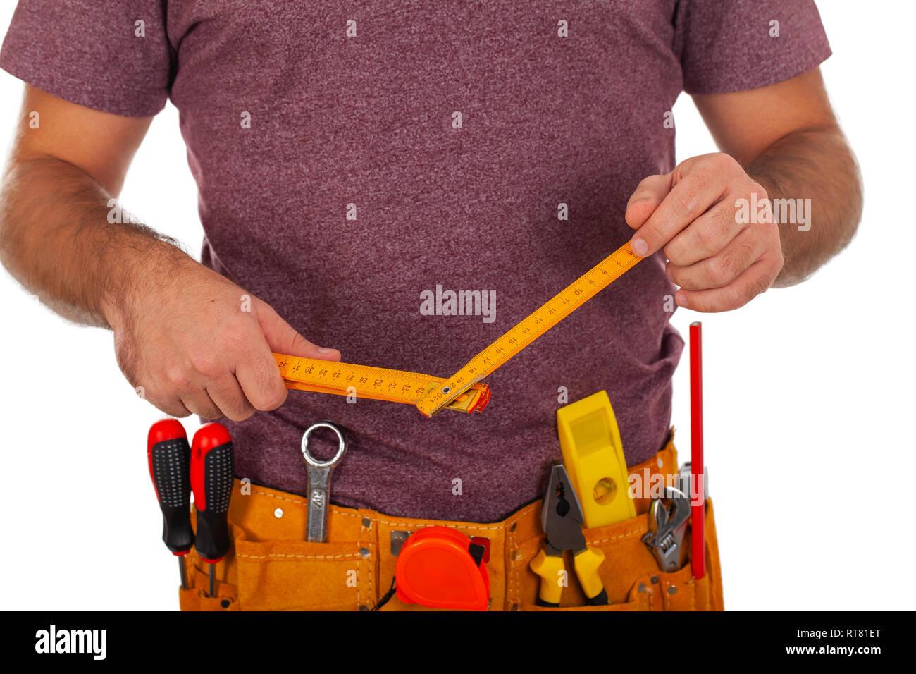 Close up picture of young carpenter with yellow tool belt, maintenance ...