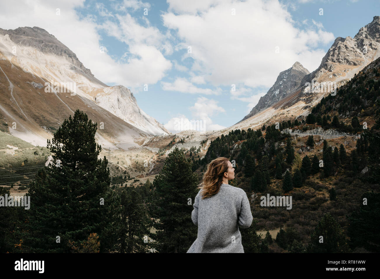 Switzerland, Grisons, Albula Pass, woman standing in mountainscape ...