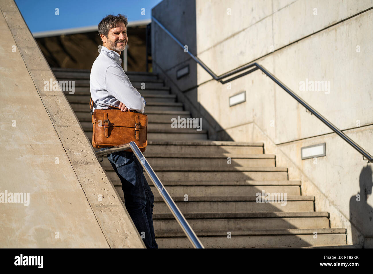 Man standing in stairs hi-res stock photography and images - Alamy