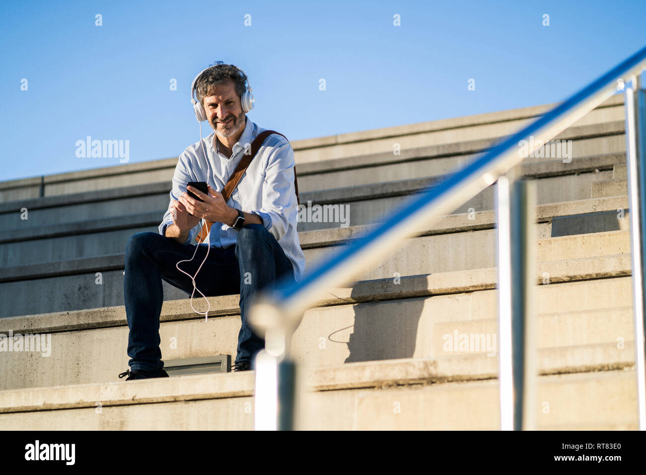 Man sitting step hi-res stock photography and images - Alamy