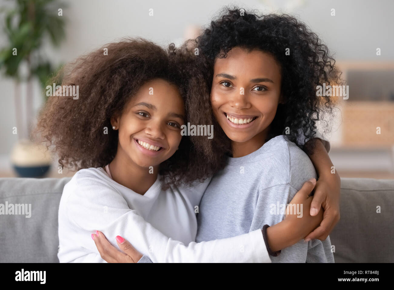 African american friends embracing hi-res stock photography and images ...
