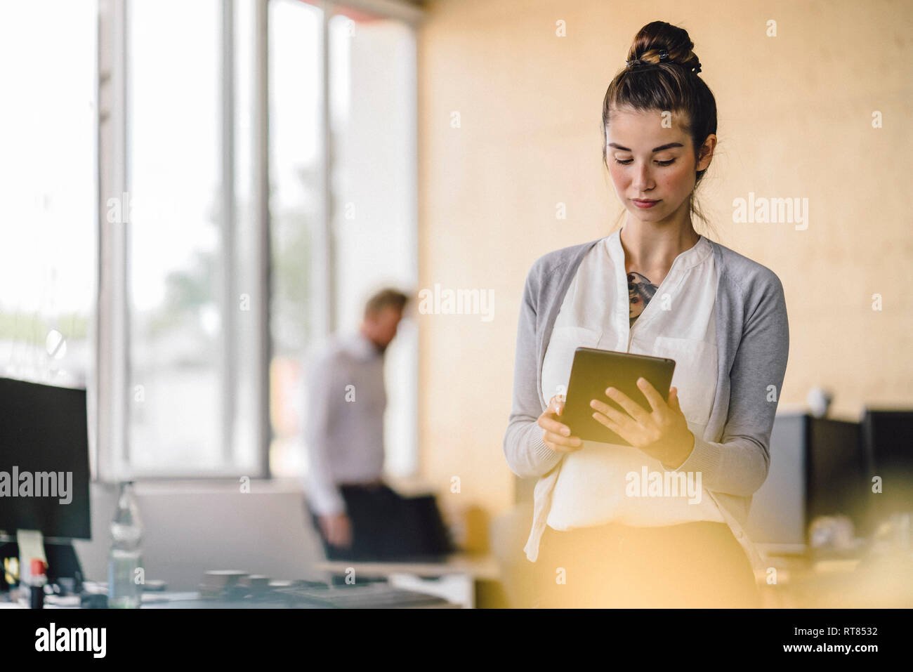 Young woman working using tablet hi-res stock photography and images ...