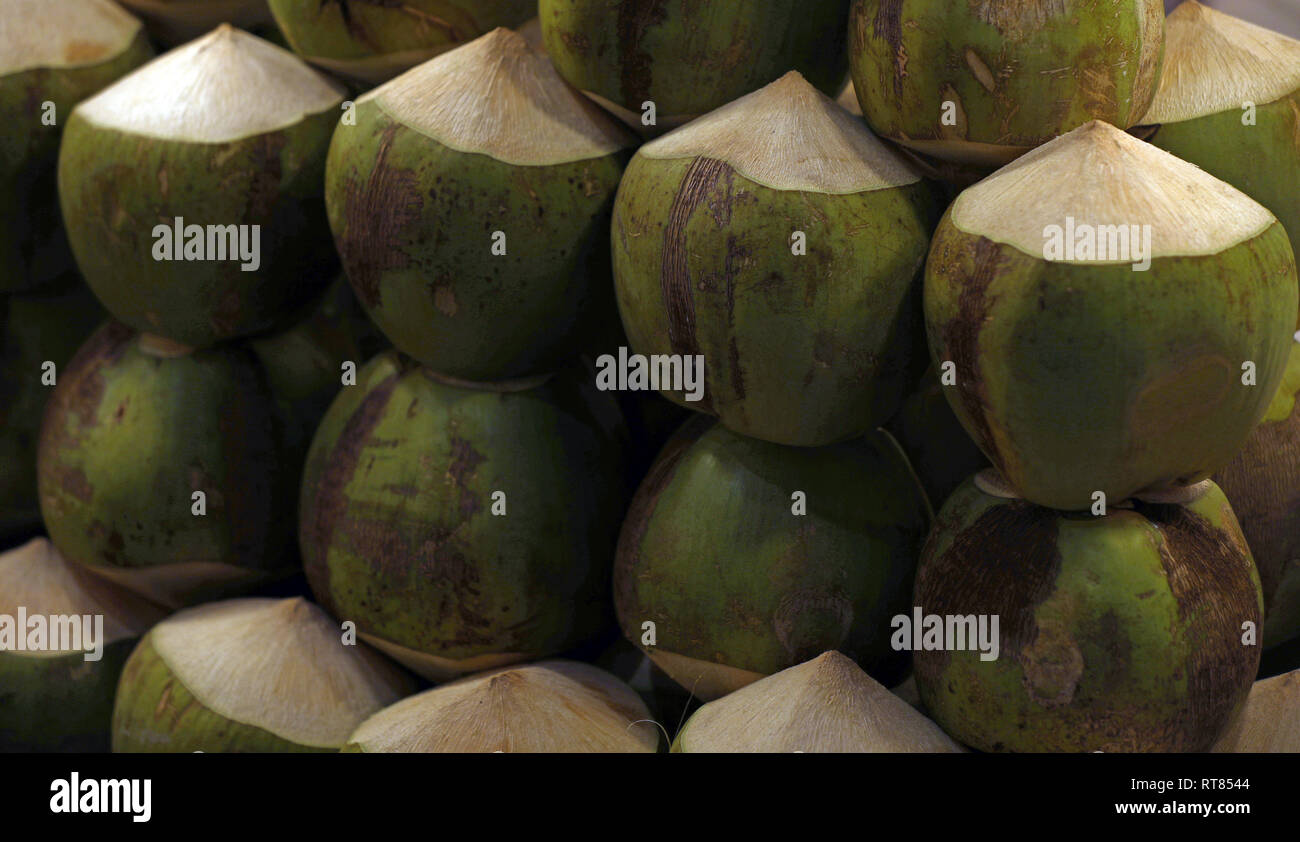 Coconut at a market stall Stock Photo - Alamy