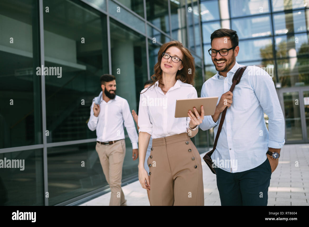 Happy business colleagues in modern office Stock Photo - Alamy