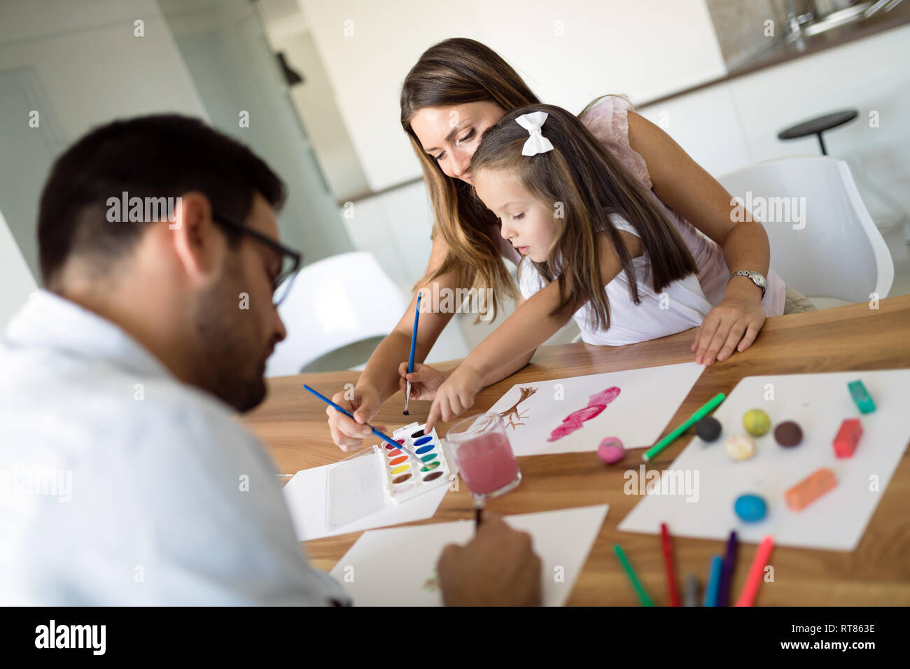 Happy family having fun time at home Stock Photo - Alamy
